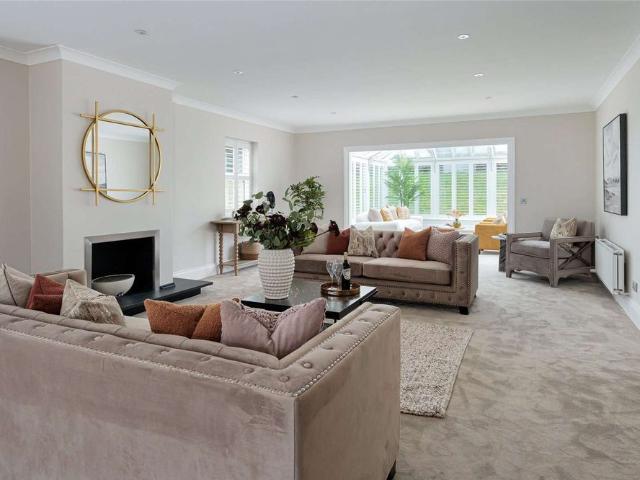 Exceptional detached residence extending to over 5,000 sq ft, set within 0.6 acres of mature south facing gardens on one of Alderley Edge’s most prestigious road