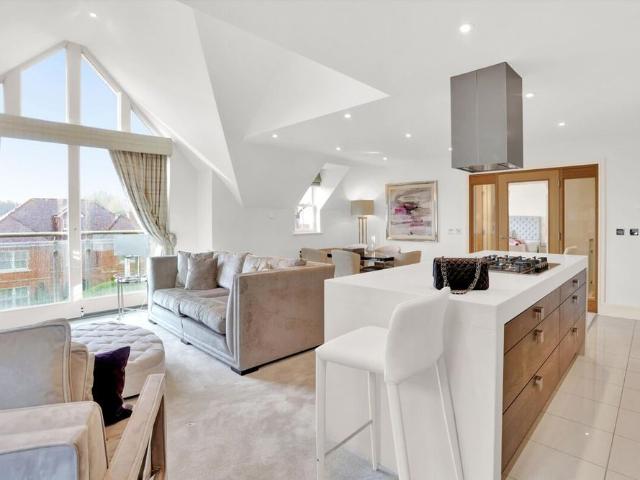 Exceptional duplex apartment in a secure gated development, featuring flexible 2/3 bedroom accommodation, private parking and easy access to Esher town centre