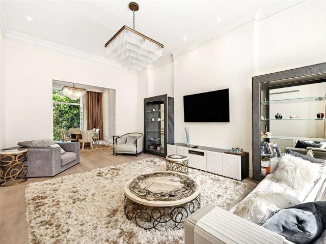 Exceptional Freehold Family Residence with Private Garden and Balcony Overlooking Prestigious Garden Square