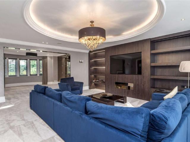 Exceptional gated residence extending to approximately 8,200 sq ft, set within mature landscaped grounds of over half an acre