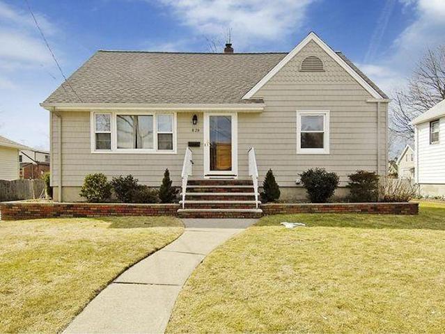 Expanded Mid Century Cape With Family Room