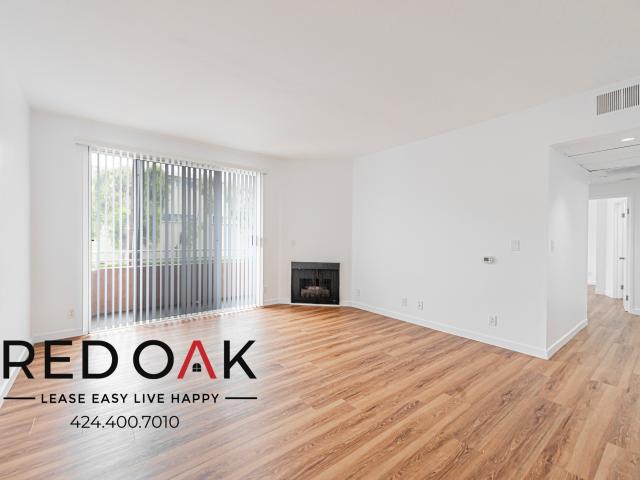 Fantastic Two Bedroom with Bay Windows, Fireplace, On Site Laundry, and Included Parking ~ In The Heart of Hollywood!