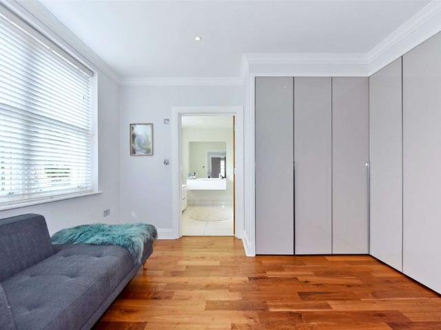 Finished to a high standard, this eight double bedroom detached family house is situated on one of Cobham's private estates