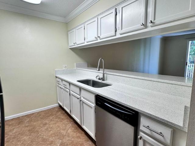 First Floor upgraded 2B/2B condo located behind Grand Boulevard in Pointe of View!