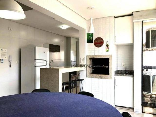 Flat com 2 dormitórios à venda, 70 m² por R$ 700.000,00 Praia das Pitangueiras Guarujá/SP