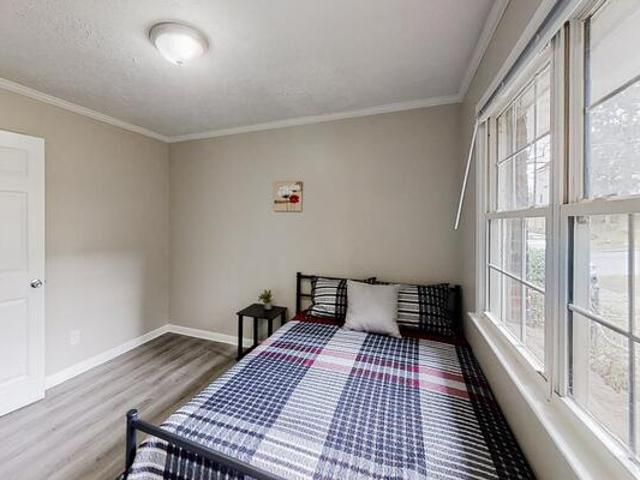 Fresh & Inviting Atlanta Home | Furnished, Secure, and Spacious | No Move In Fee, Free Wi Fi, Monthly Cleanings, Bus Stop 0.9 Mile Away, and Grocery Store 0.9 Miles Away