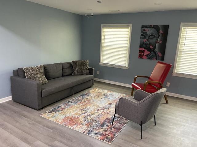 Fridge, Tv and queen bed in furnished room
