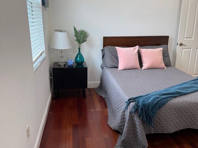 Furnished Bedroom with attached full bathroom
