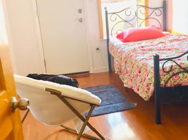 Furnished Bedroom with Backyard Access