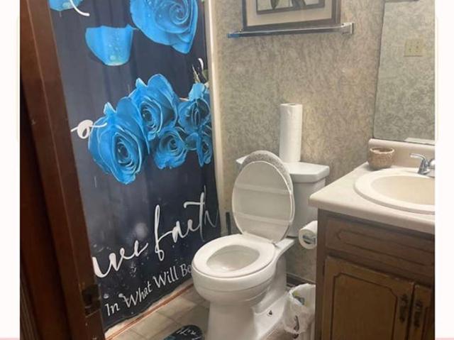 Furnished bedroom with bathroom
