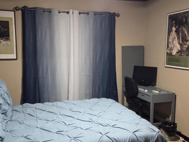 Furnished bedroom with luxurious private bath