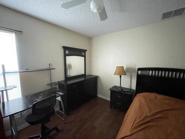 furnished bedroom with private bath