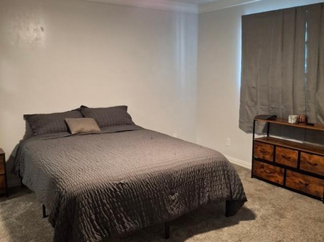 Furnished bedroom with private bath