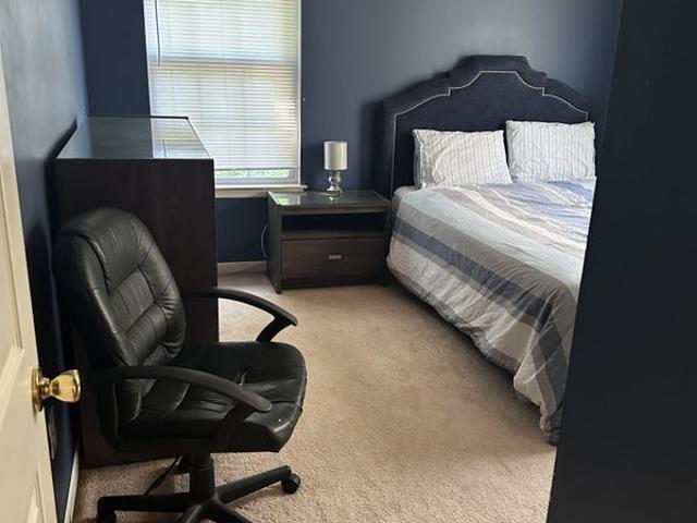 Furnished bedroom with private bathroom