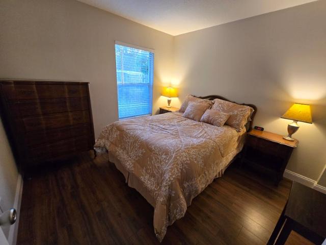 Furnished bedroom with private bathroom
