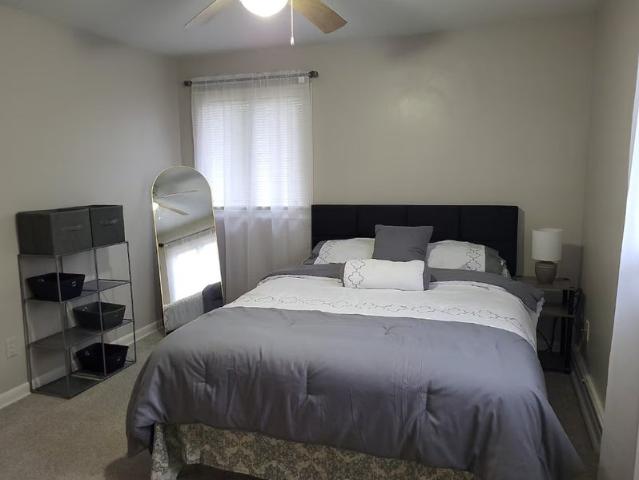 Furnished bedroom and an attached bathroom