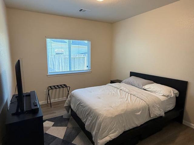 Furnished bedroom in a peaceful family home