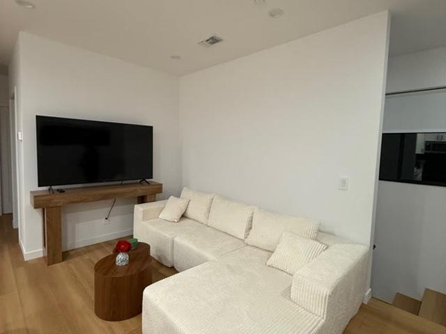 Furnished master bedroom with a private bathroom