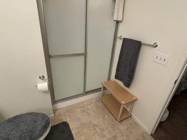 Furnished master bedroom with bathroom