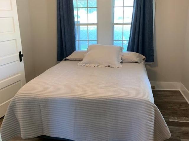 Furnished private bedroom with attached washroom