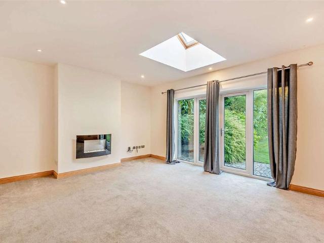 High specification gated home with fabulous South facing garden, well located on one of on the most sought after roads in Cheshire