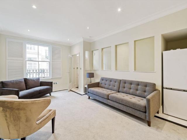 HMO friendly three bedroom apartment arranged over the ground and lower ground floors in Bayswater