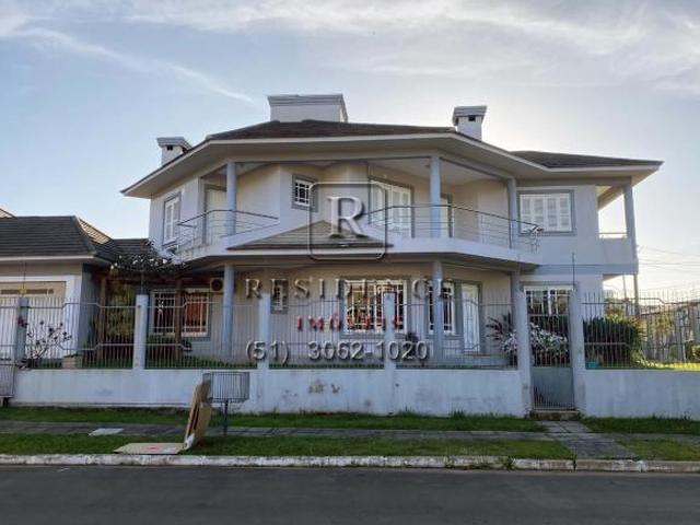 Imóvel de Luxo: Casa com 3 quartos, 3 suítes e 259,85m² à venda em Canoas RS, bairro Marechal Rondon