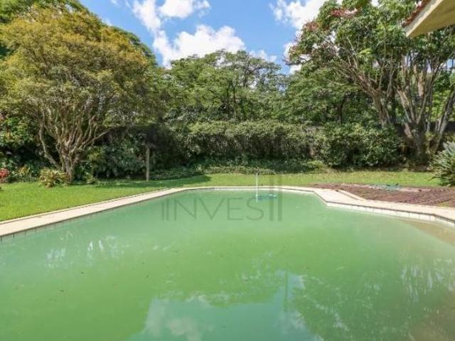 Imponente mansão de 4 suítes no Jardim Guedala: 6 salas, 6 banheiros, 6 vagas e 748m² em São Paulo S