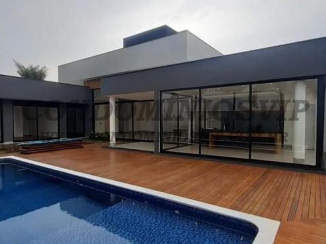 Imponente residência de 4 suítes no Saint Patrick: 486m², 3 salas, 7 banheiros, 4 vagas Sorocaba S