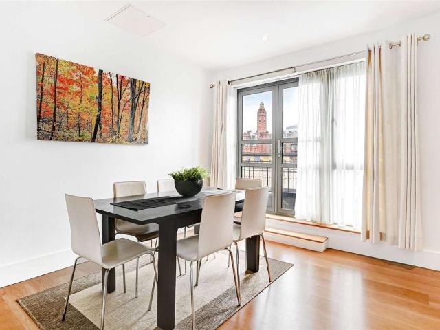 Impressive modern 2 bedroom, 2 bathroom split level apartment with garaged parking and 24/7 concierge
