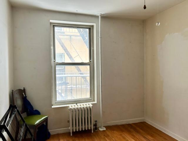 Large Bedroom with Fire Escape for Female Apt