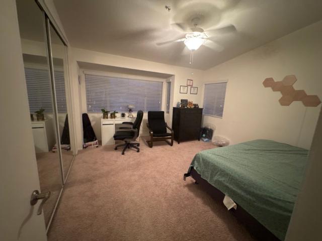 Large bedroom with shared bathroom within a family