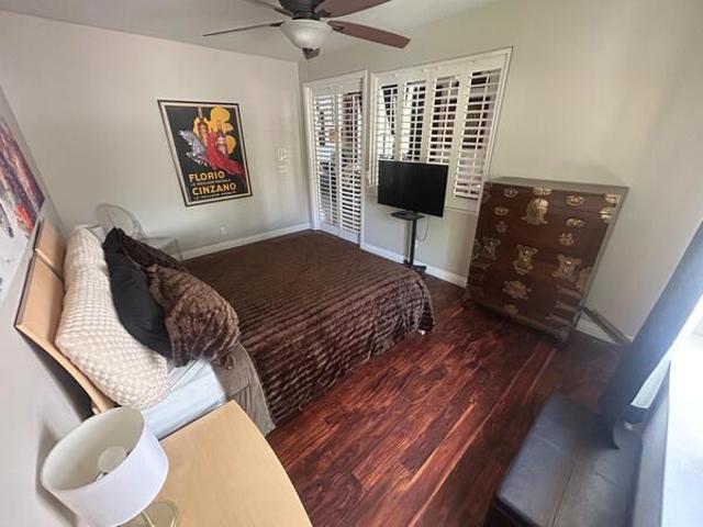 Large Bright Bedroom with TV