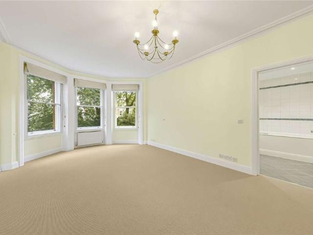Lateral four bedroom family apartment set within a portered block and over 2106 square feet