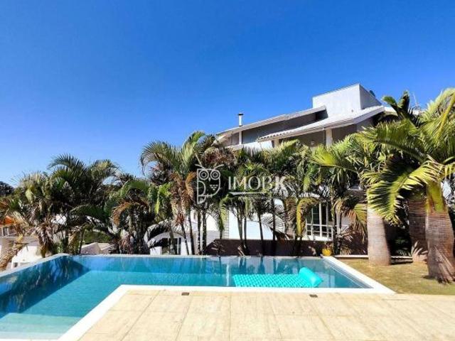 Linda casa em condominio com 3 suites com piscina de borda infinita!