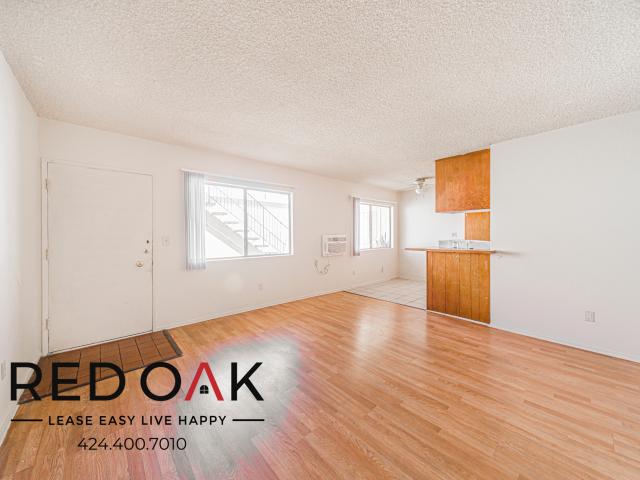 Light Filled One Bedroom with Elegant Floors, On Site Laundry, and Parking Included ~ In Coveted Van Nuys!