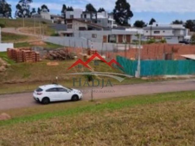 Lote à venda em condomínio fechado, com 869 m²