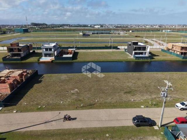 Lote exclusivo, frente sul e fundos para o lafo no condomínio fechado Zen Concept Resort em Xangri L
