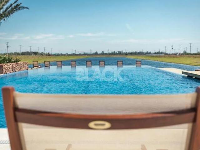 Lote fundos lago em condomínio Torres RS