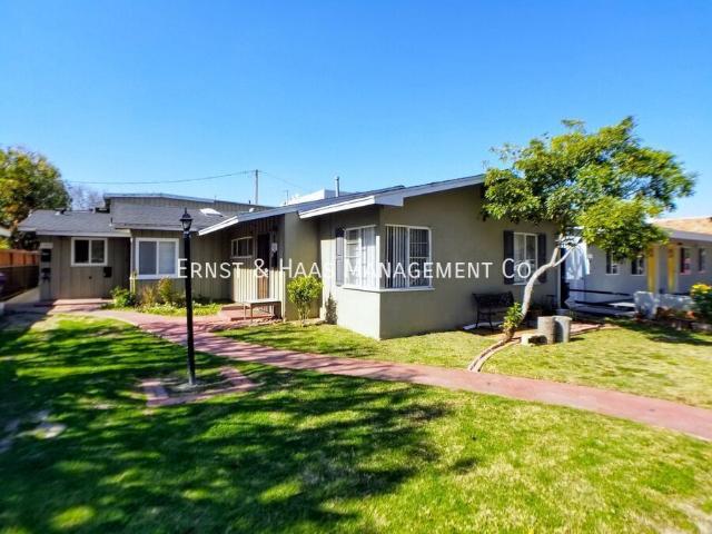 Lovely 5 Bedroom, 2 Bath Apartment Home with Open Beam Ceilings!