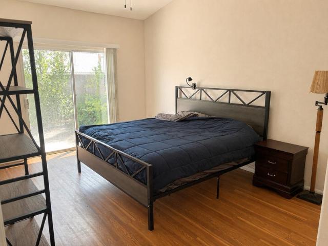 Master bedroom w/ attached bathroom w/ backyard
