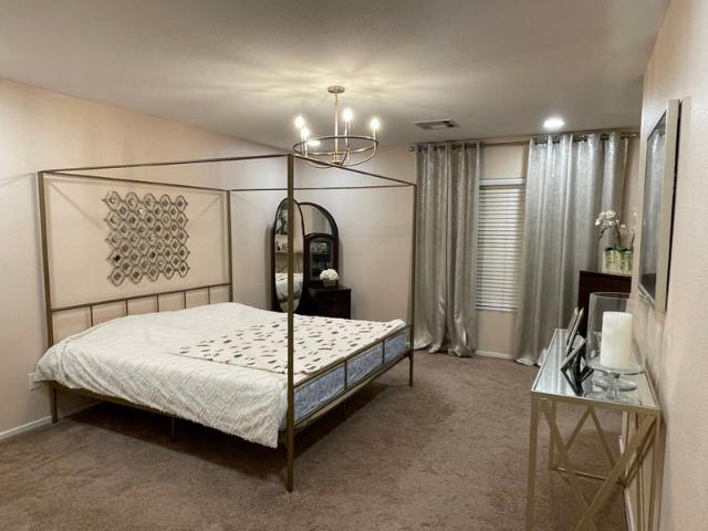 Master bedroom with king size bed and private bath