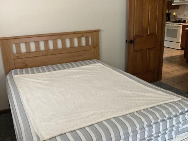 Medium sized bedroom with nice queen sized bed