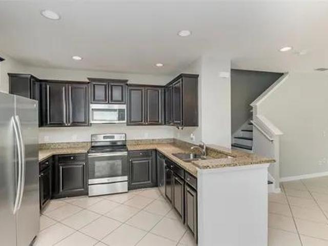 Move In Ready End Unit Townhome with Water Views!