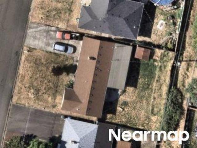 NE Hughes St