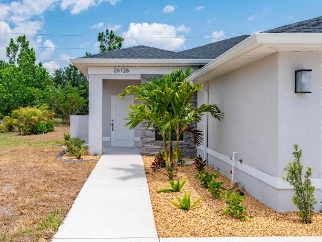 NEW Villa duplex home with quartz counters, 2 car garage, and a rear patio