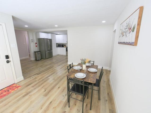 Newly remodeled home with dining area and back yar