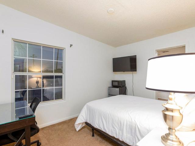 Newly renovated Las Vegas home! Rooms with personal Fridge/Freezer, Smart TVs, Workspace, and more!