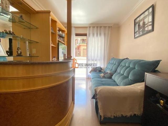 NO CENTRO APARTAMENTO SEMI MOBILIADO 2 DORMITÓRIOS