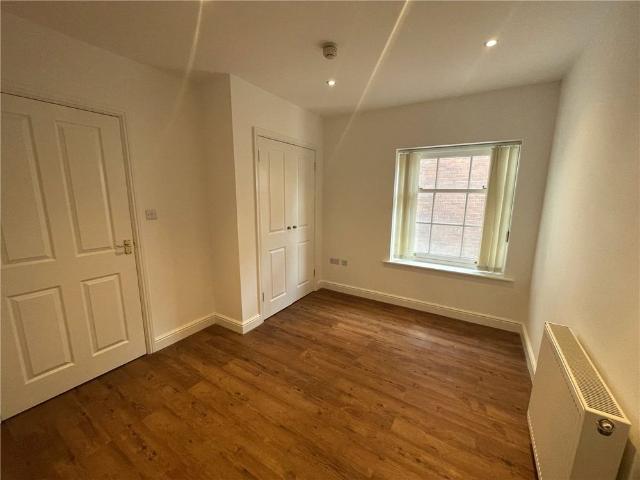 One bedroom top floor flat in the centre of town with allocated parking